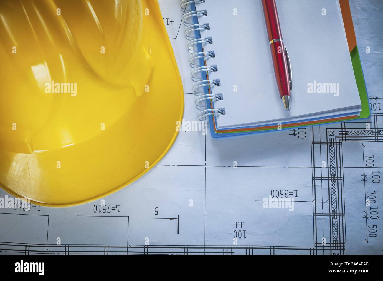Safety building helmet notepad pen on blueprint Stock Photo - Alamy