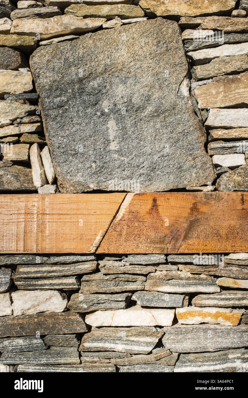 Wall built of stones. Densely arranged stones. Sun light Stock Photo ...