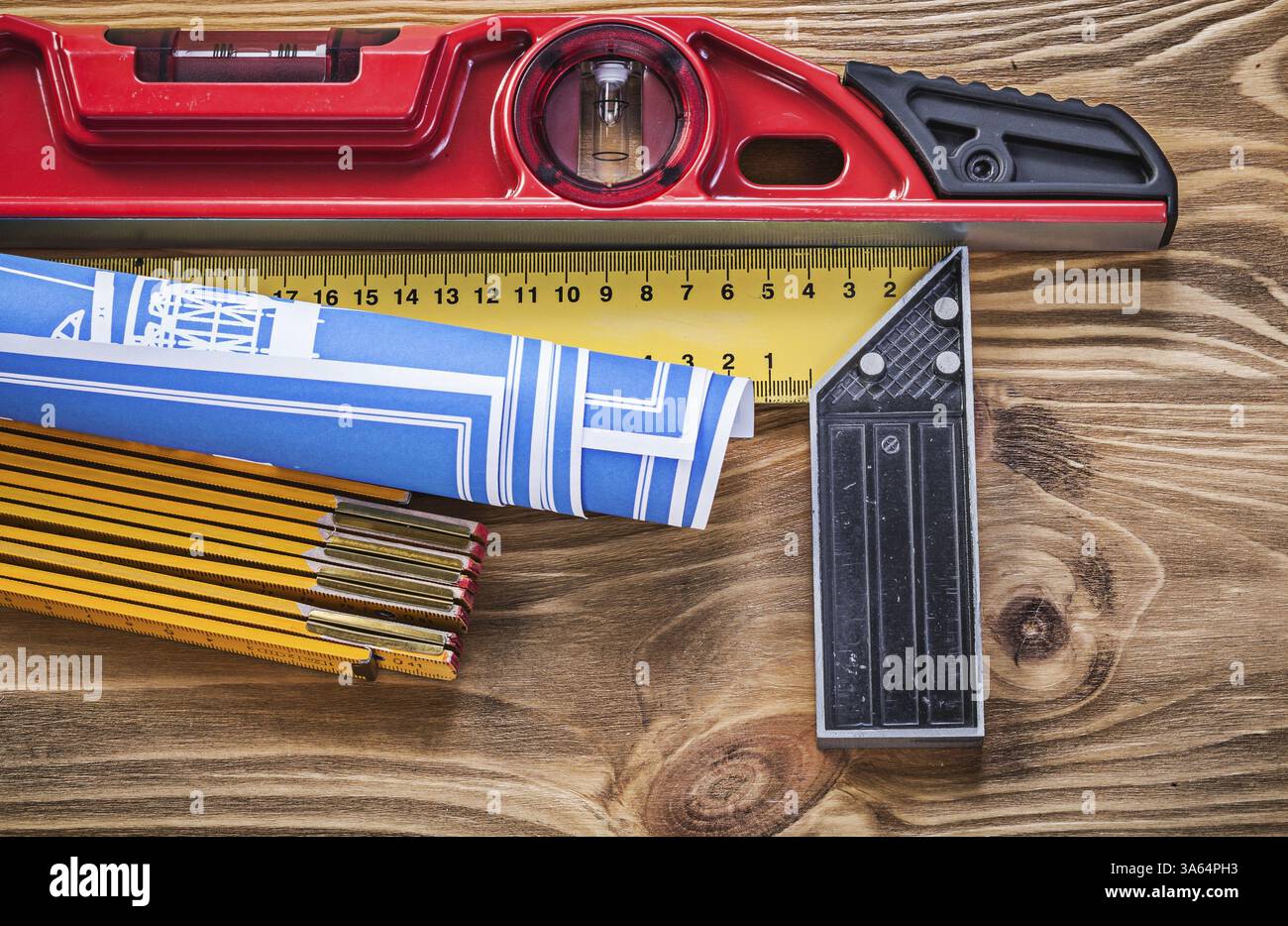 Construction level blue blueprint wooden meter square ruler on vintage ...