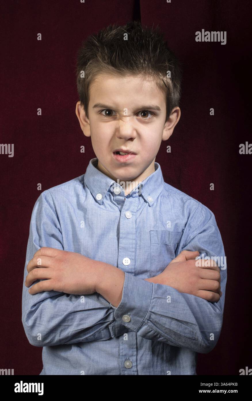 Frowning boy in blue hi-res stock photography and images - Alamy