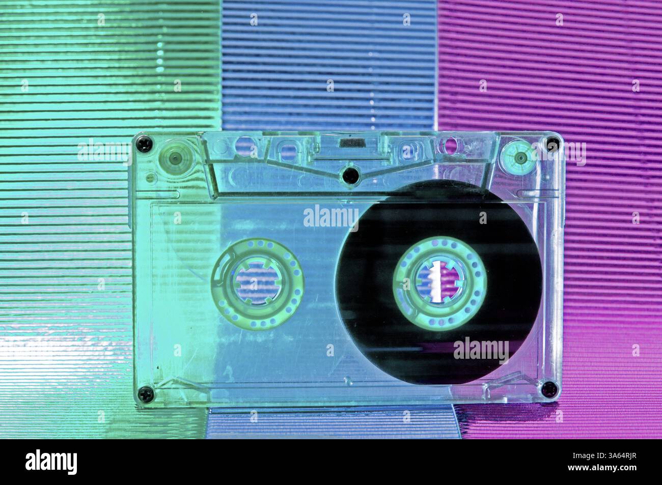 Transparent Cassette tape. Pink and blue background Stock Photo - Alamy