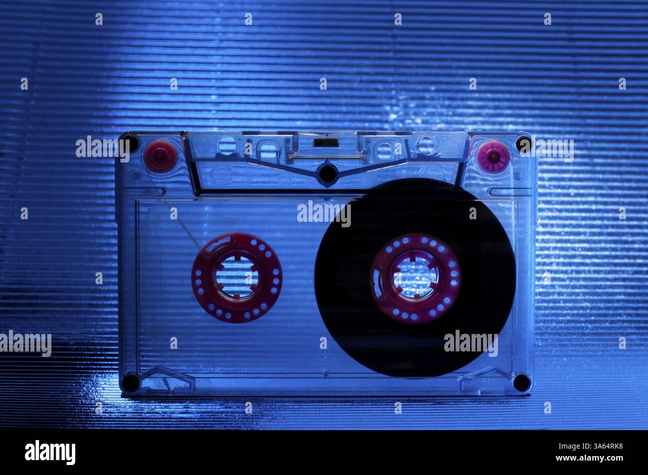 Transparent Cassette tape. Blue color background Stock Photo - Alamy