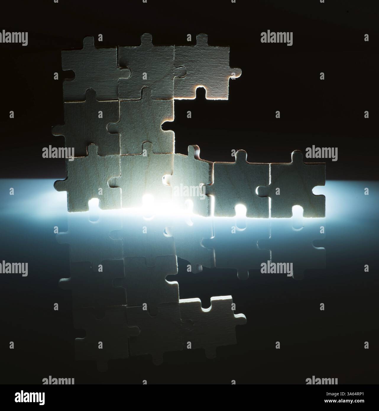 Wooden puzzle and backlight background. Vertically stacked parts Stock ...