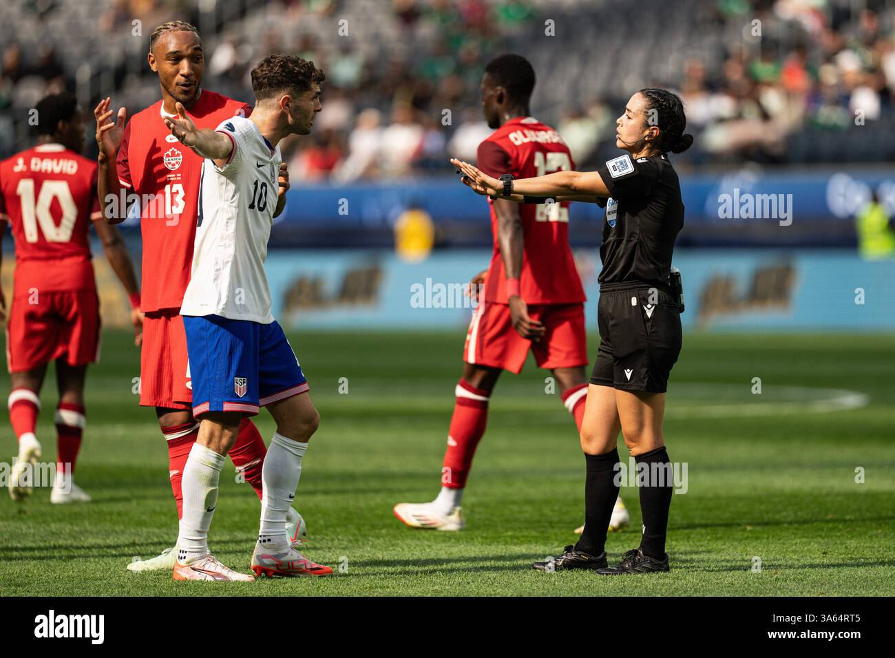 United States forward Christian Pulisic (10) has words with referee ...