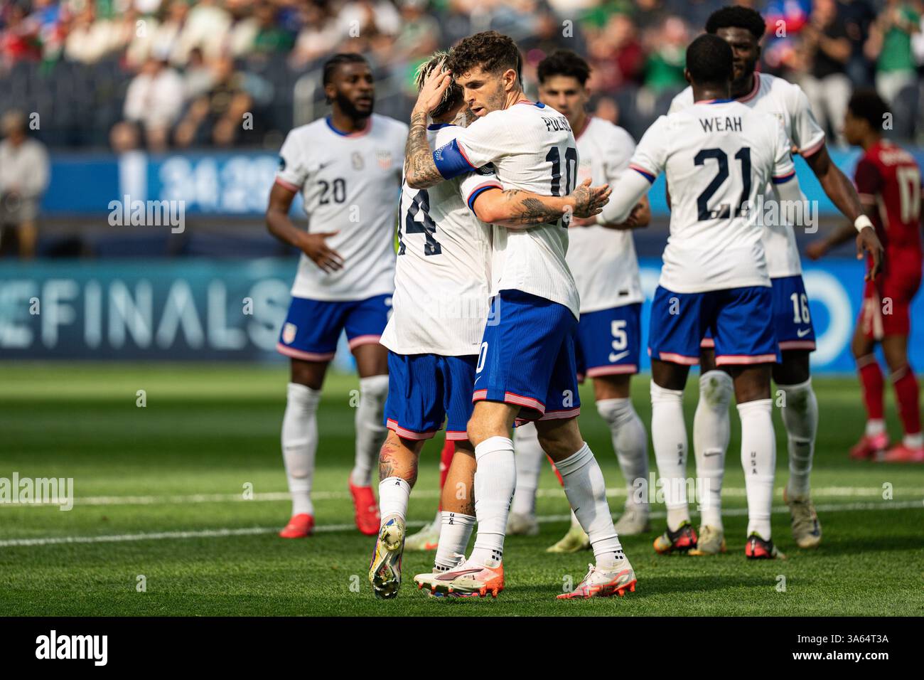 United States forward Christian Pulisic (10) celebrates with midfielder ...
