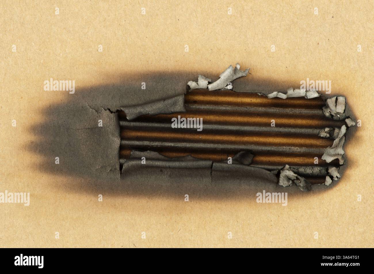 Burned paper and close up hole Stock Photo - Alamy