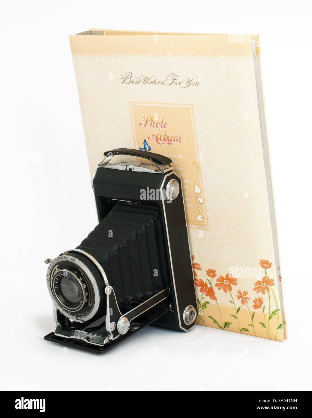 Old vintage Camera and Photo Album white isolated Stock Photo - Alamy