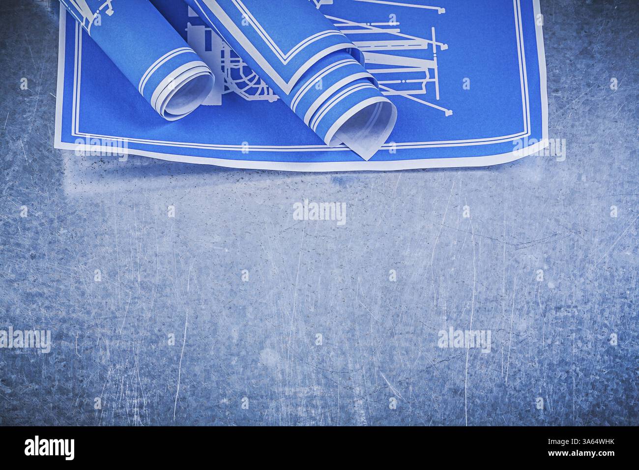 Blue engineering drawings on metallic background maintenance concept ...