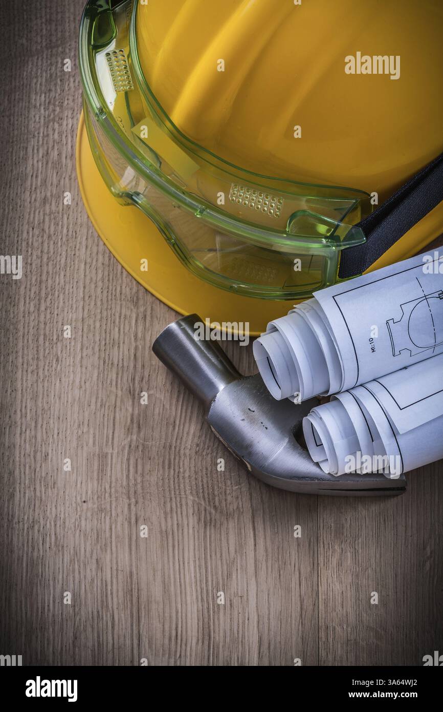 Claw hammer goggles blueprints and building helmet on wood board Stock ...