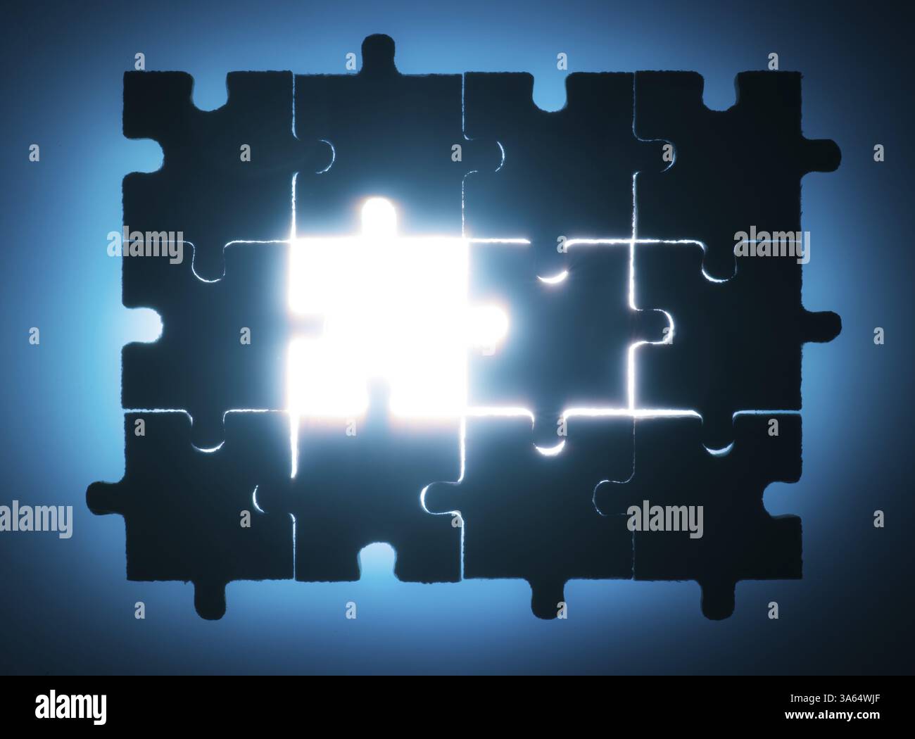 Wooden puzzle and backlight background. Close up. Blue color light ...