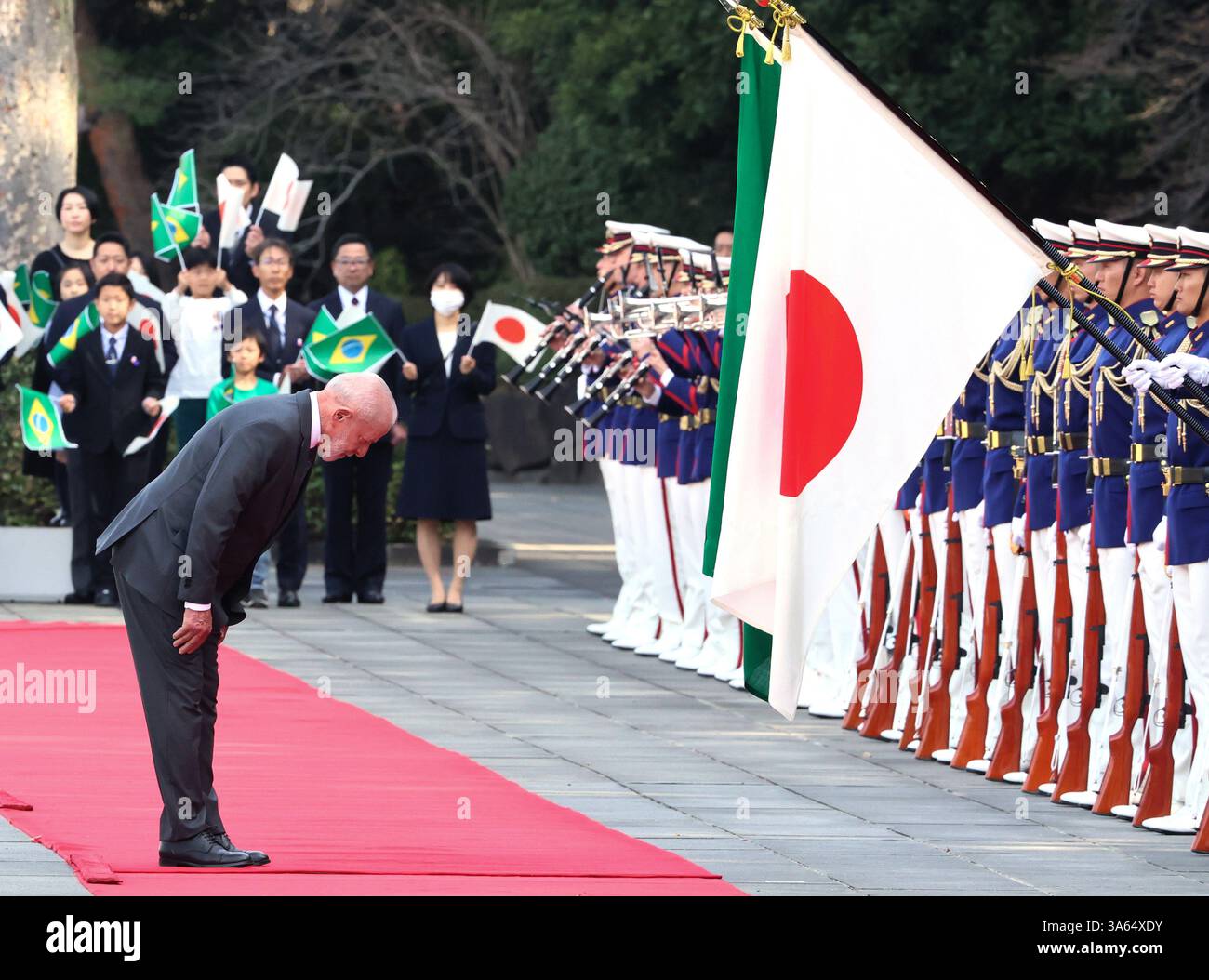 Brazilian President Luiz Inacio Lula da Silva bows his head before ...