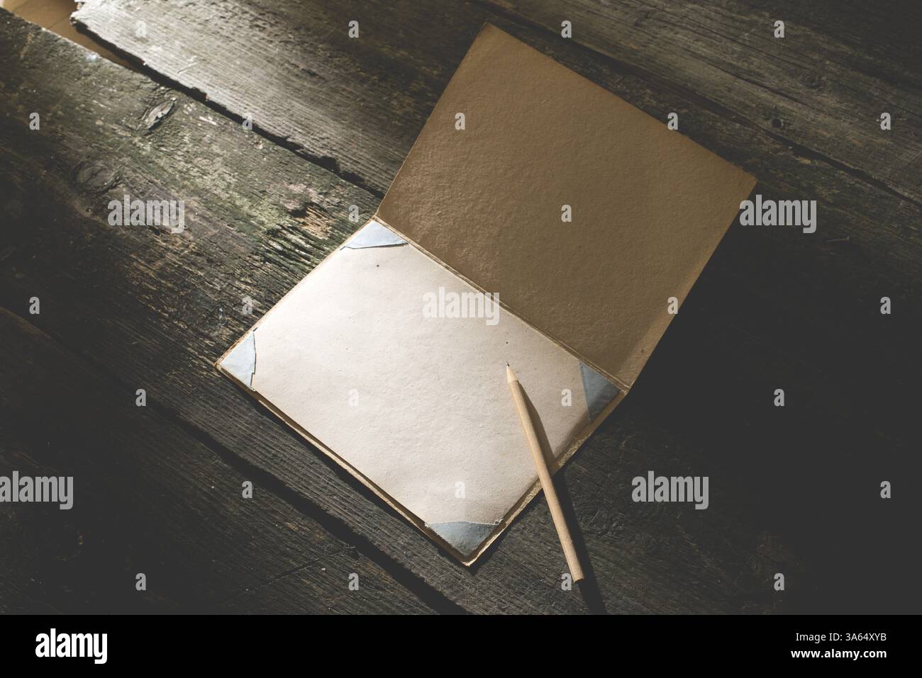 Vintage pencil and drawing paper. Weak sunlight Stock Photo - Alamy