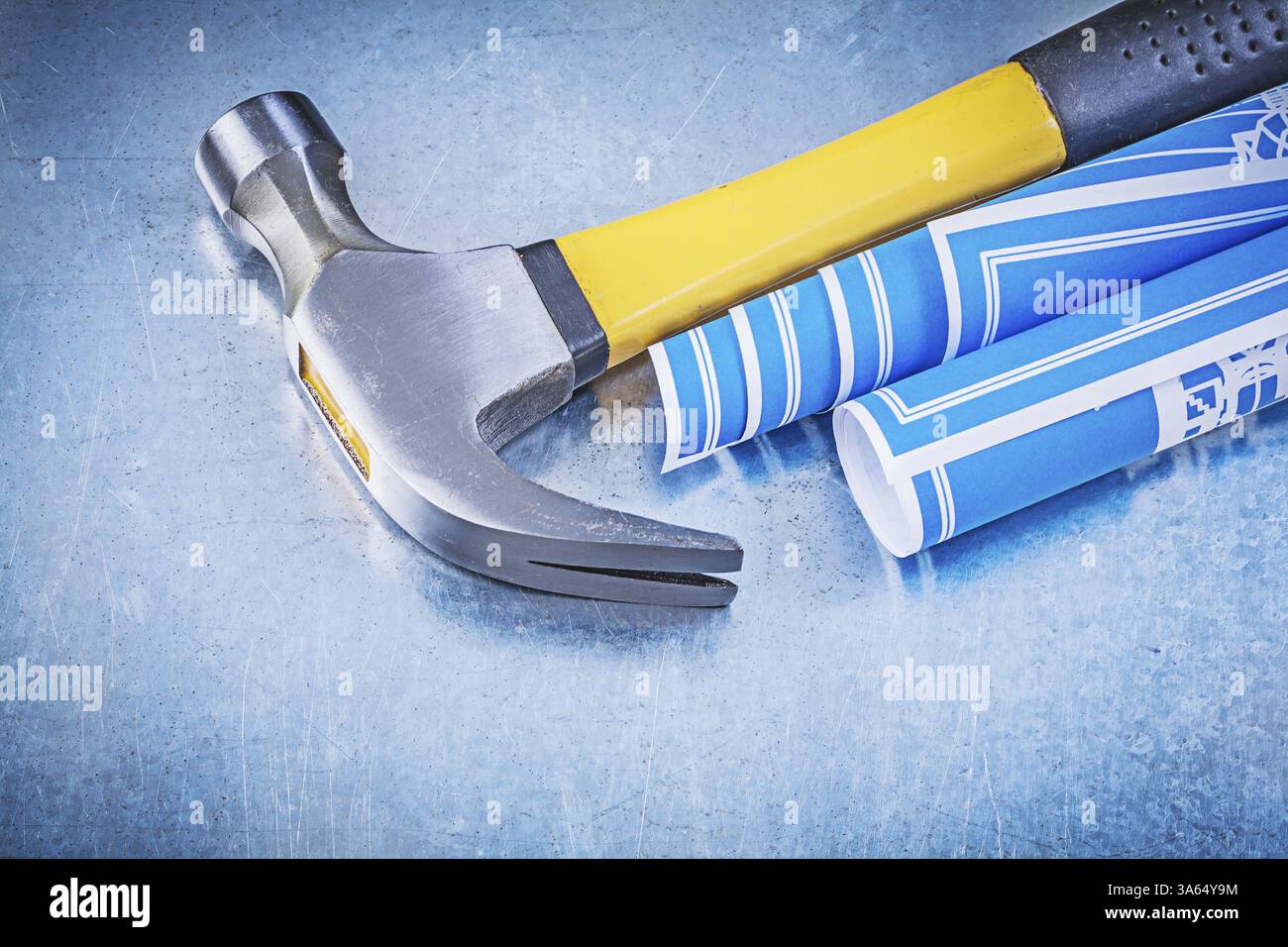 Blue construction drawings claw hammer on metallic background Stock ...
