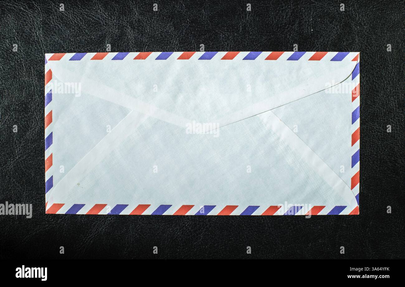 Vintage envelope on black background. Red and blue lines Stock Photo ...