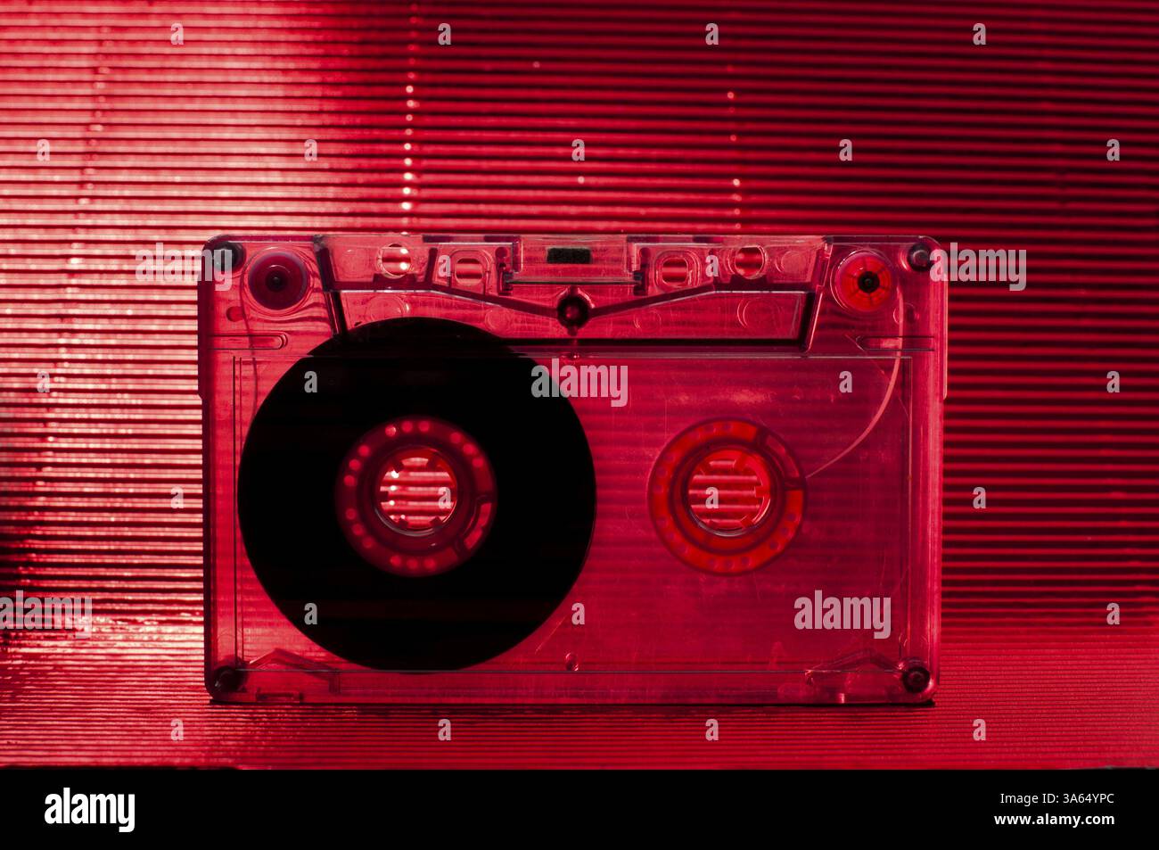 Transparent Cassette tape. Red color background Stock Photo - Alamy