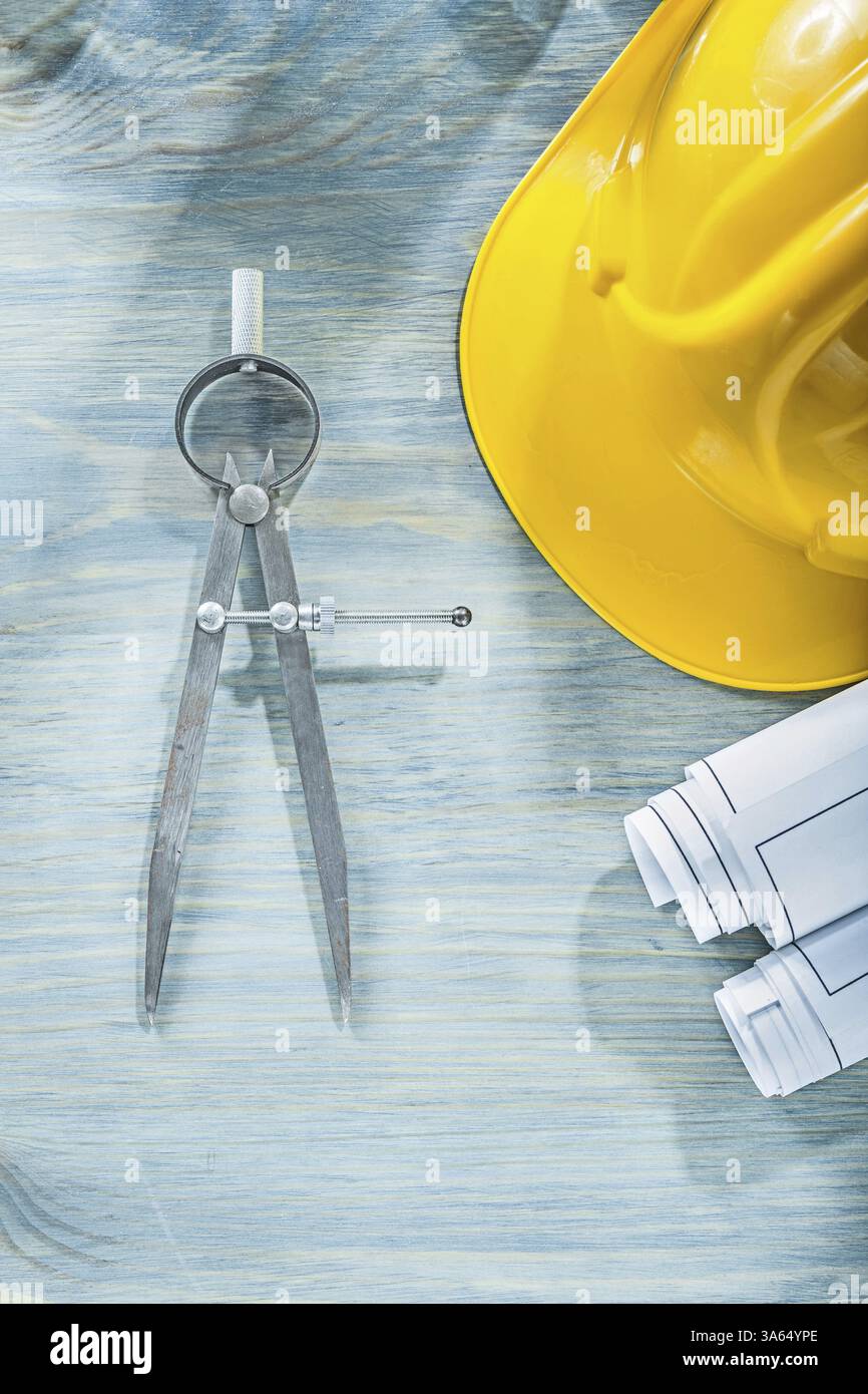 Divider engineering drawings hard hat on wooden board construction ...