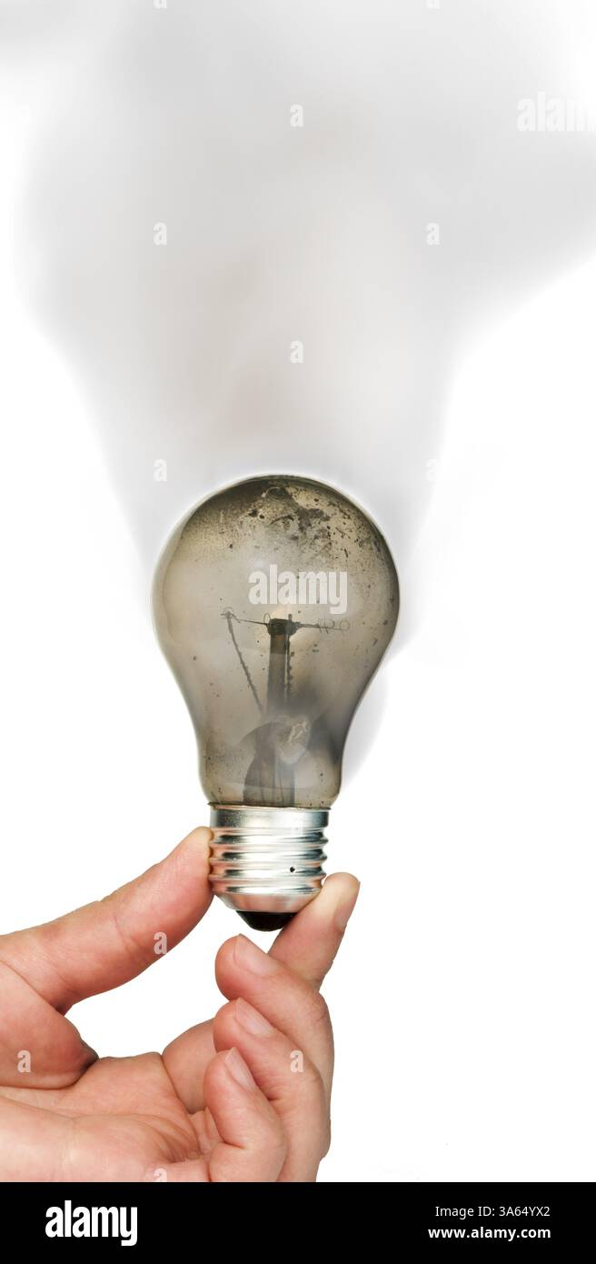Old light bulb burned inside and smoke Stock Photo - Alamy