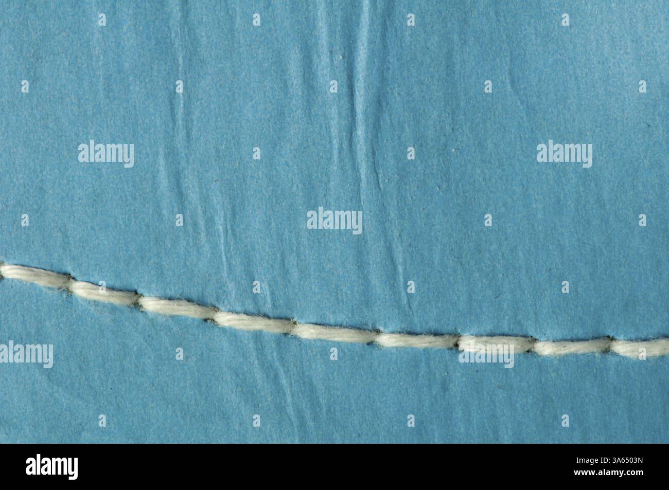 Blue paper texture with seam Stock Photo - Alamy