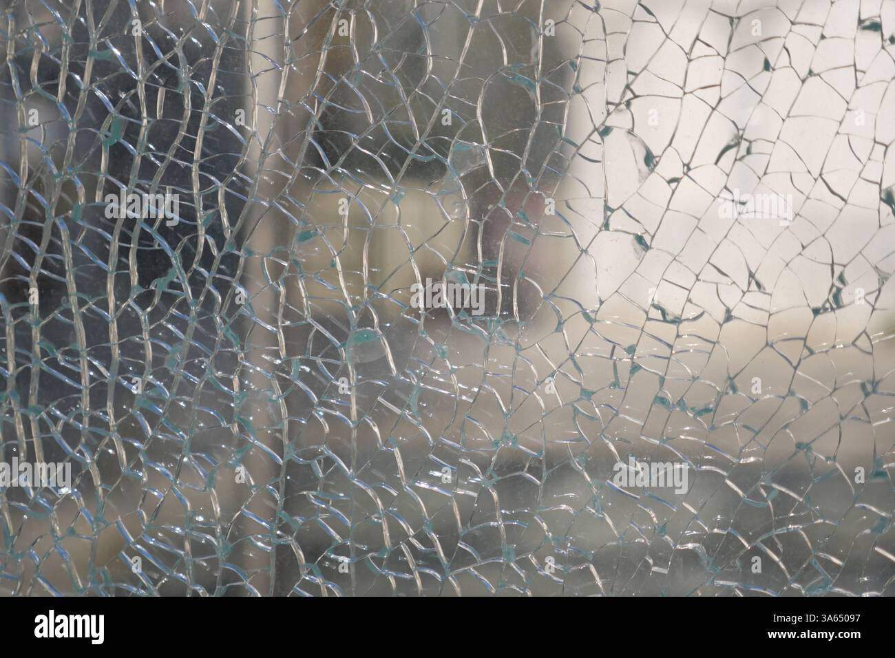 Shattered glass displaying intricate patterns in bright light Stock ...