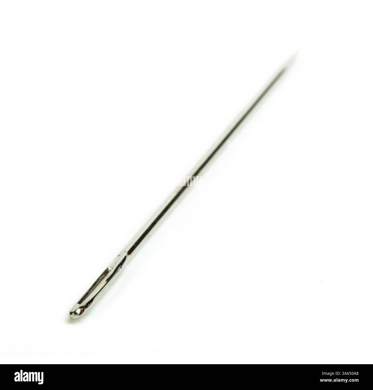 Sewing needle close up. White isolated Stock Photo - Alamy