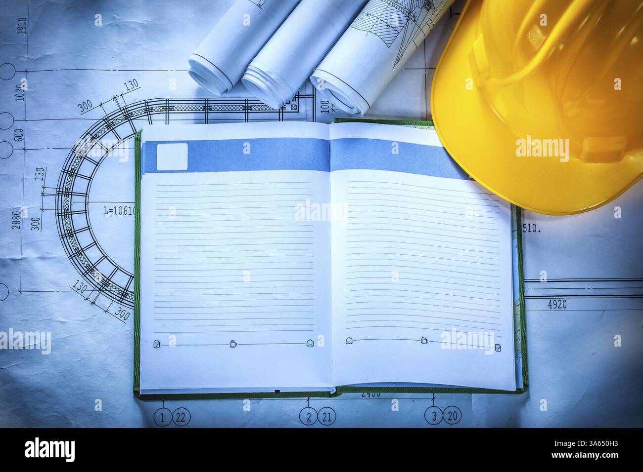 Protective hard hat construction plans notepad on blueprint Stock Photo ...