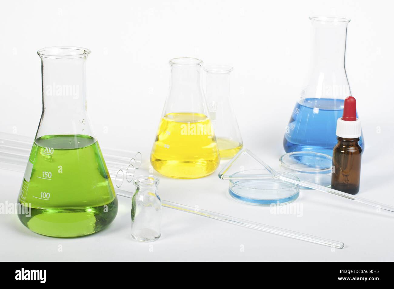 Laboratory glassware equipment. Laboratory beakers filled with colored liquid substances Stock ...