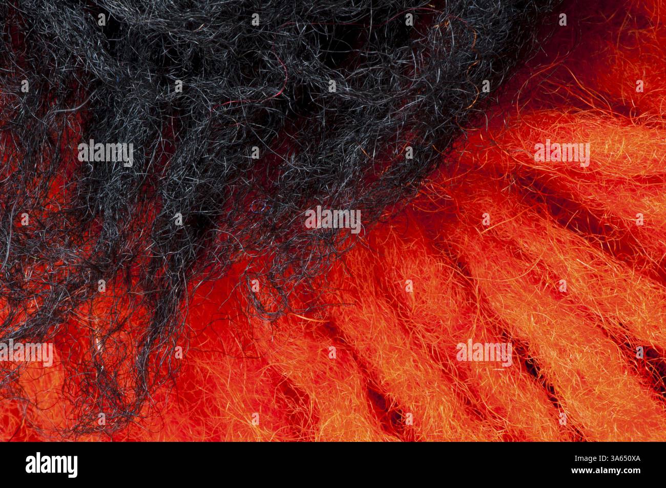 Black and red wool fibers closeup Stock Photo - Alamy