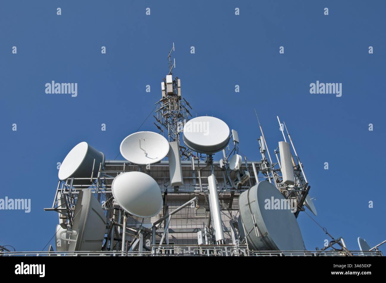 Transmitters, antennas and repeaters on building Stock Photo - Alamy