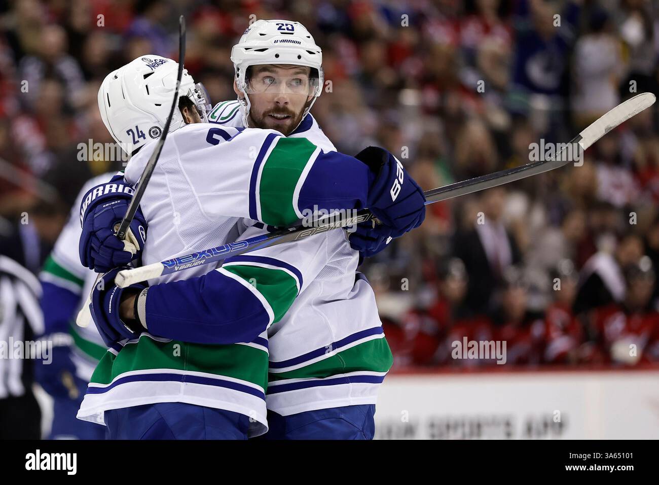 Vancouver Canucks center Pius Suter (24) is congratulated after scoring ...