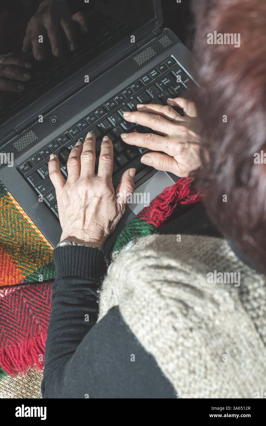 Old women using old laptop Stock Photo - Alamy