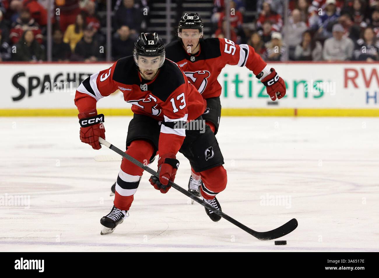 New Jersey Devils center Nico Hischier (13) skates with the puck during ...