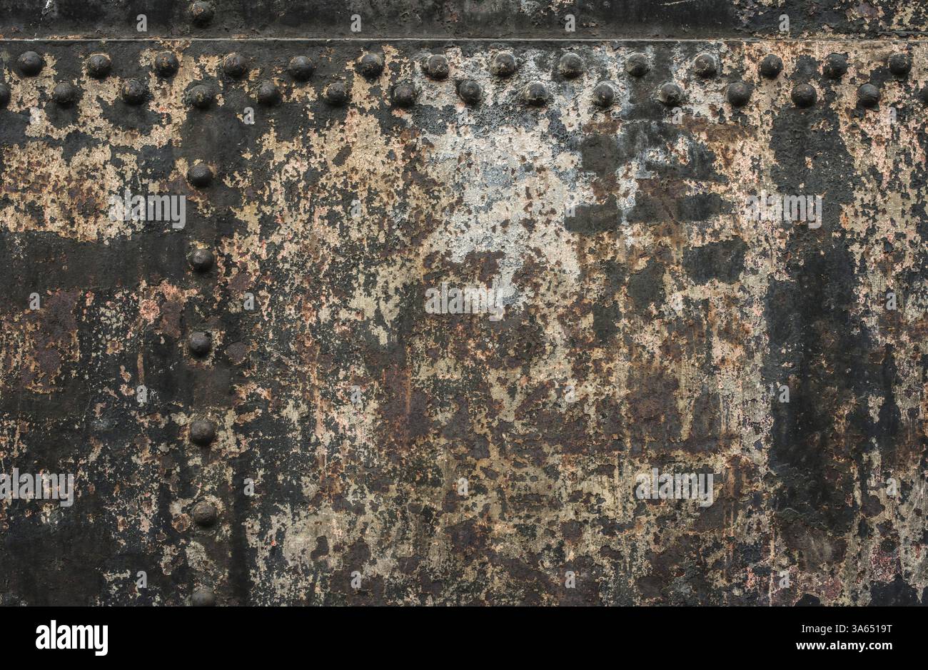 Black metal wall with rivets Stock Photo - Alamy