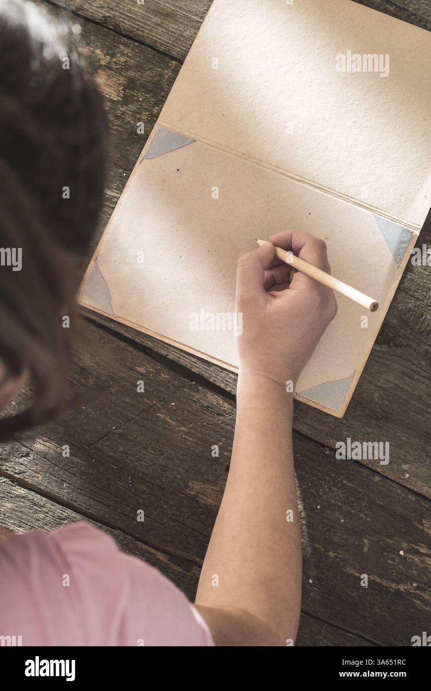 Vintage pencil and drawing paper. Weak sunlight Stock Photo - Alamy