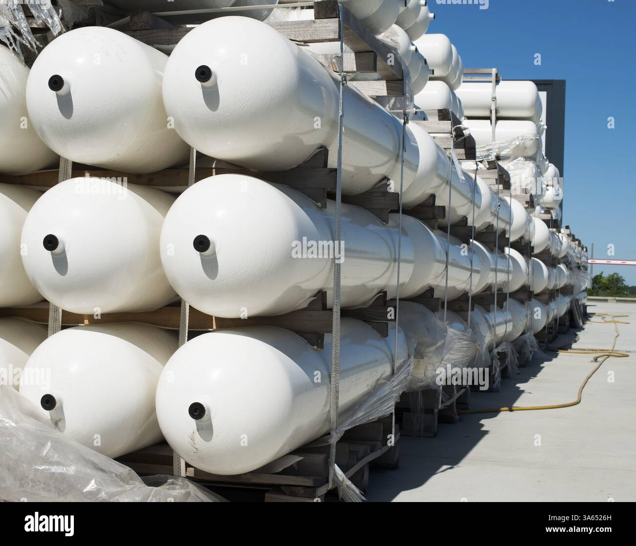 White industrial butan bottles.Compressed natural gas Stock Photo - Alamy