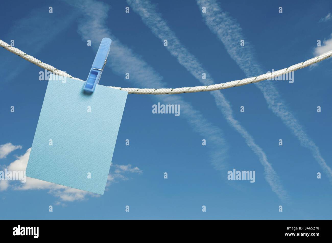Picture template hooked on a rope. Sky background Stock Photo - Alamy