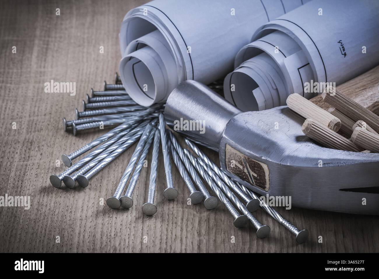 Composition of blueprint rolls claw hammer dowels and construction ...