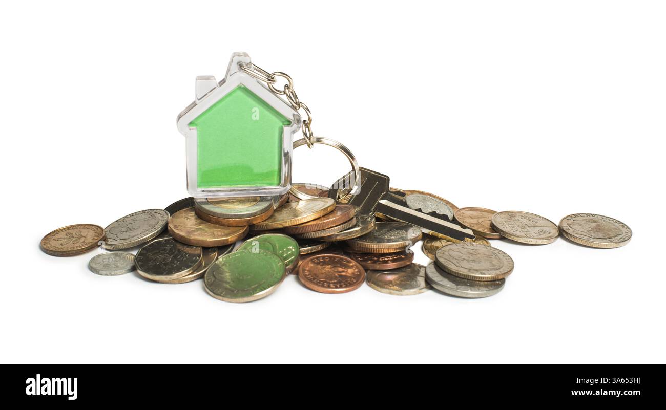 Coins and green house key ring. White isolated studio shot Stock Photo ...