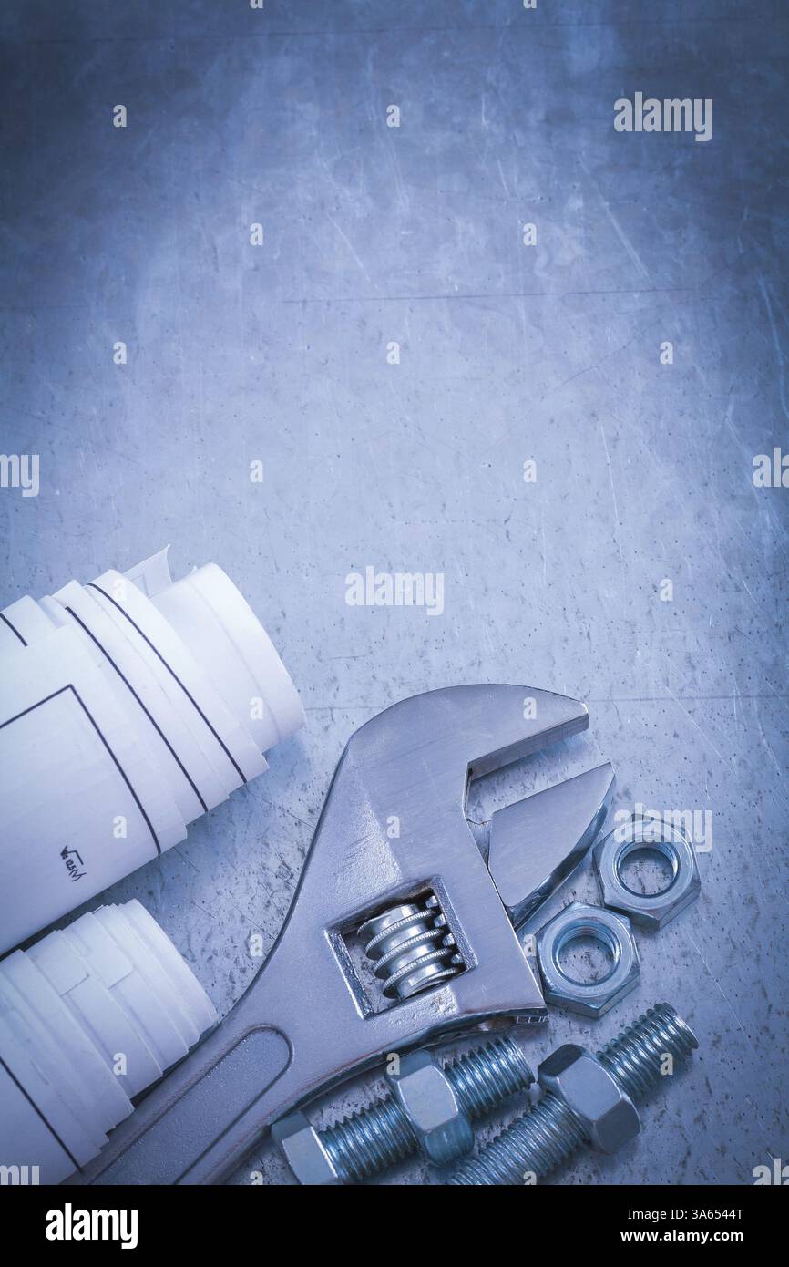 Copy space of adjustable wrench screw-nuts bolts and rolls of ...