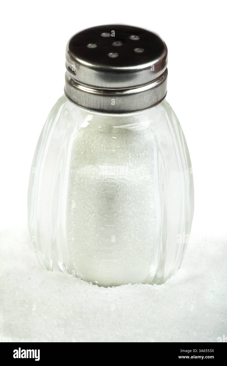 Salt and saltshaker on white background Stock Photo - Alamy