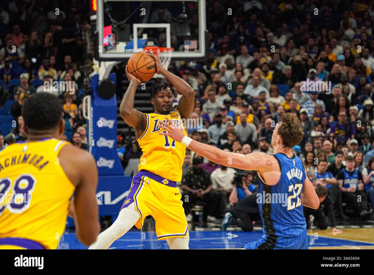 Orlando, Florida, USA, March 24, 2025, Los Angeles Lakers forward Dorian Finney-Smith #17 makes ...
