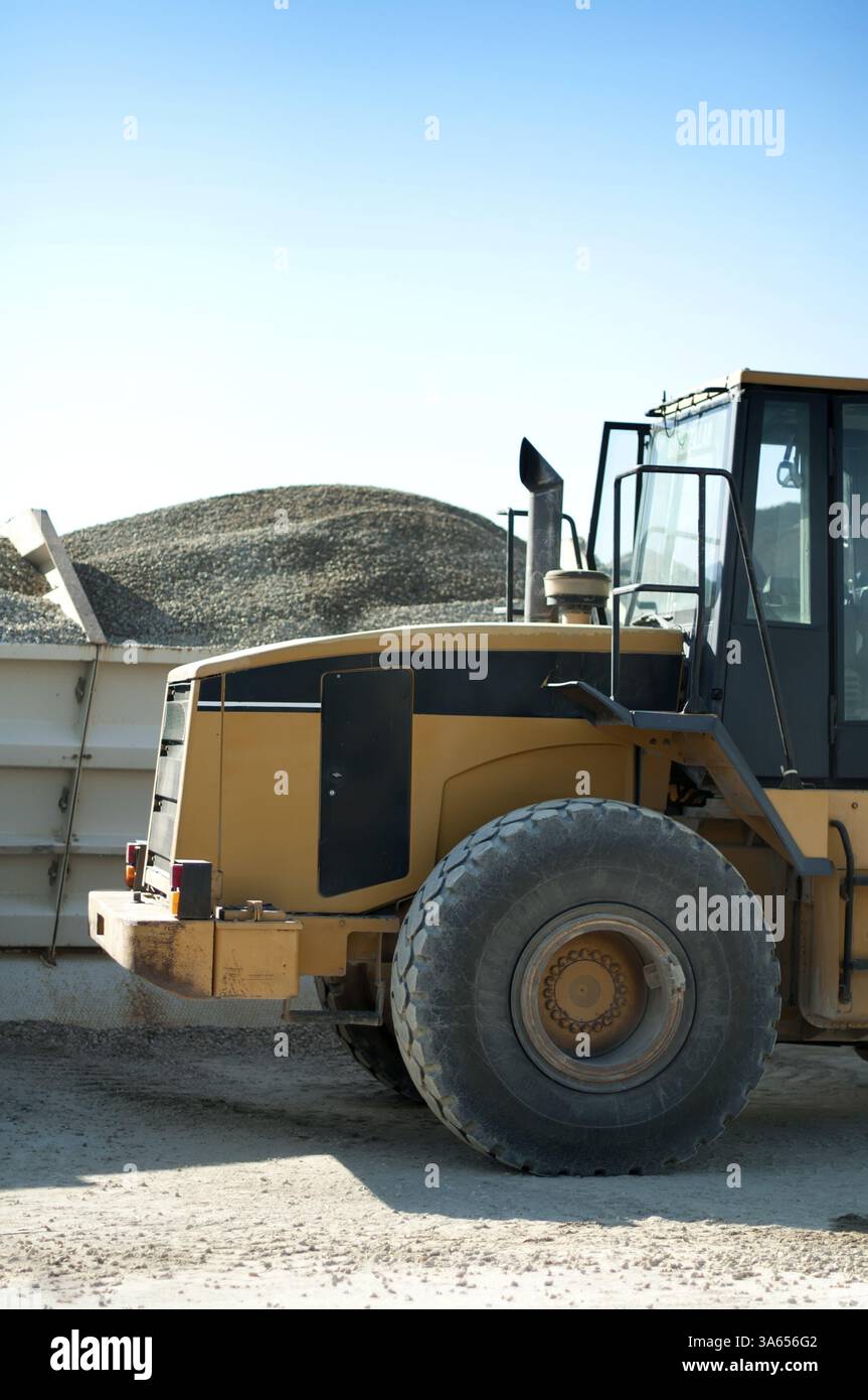 Excavator close-up and piles of sand background Stock Photo - Alamy