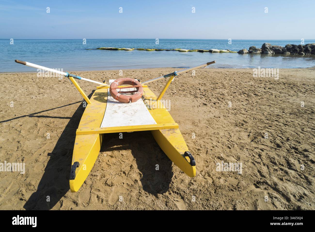 Yellow lifeboat on the beach. Italian beach Stock Photo - Alamy