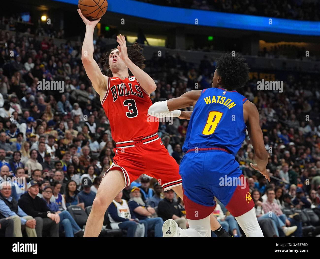 Chicago Bulls guard Josh Giddey, left, drives to the basket as Denver ...