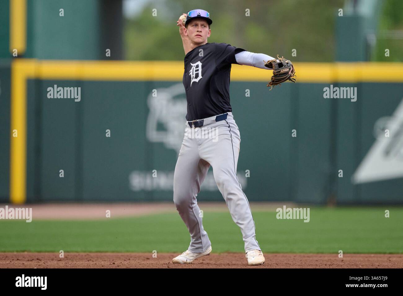 Detroit Tigers third baseman Carson Rucker (59) throws to first base ...