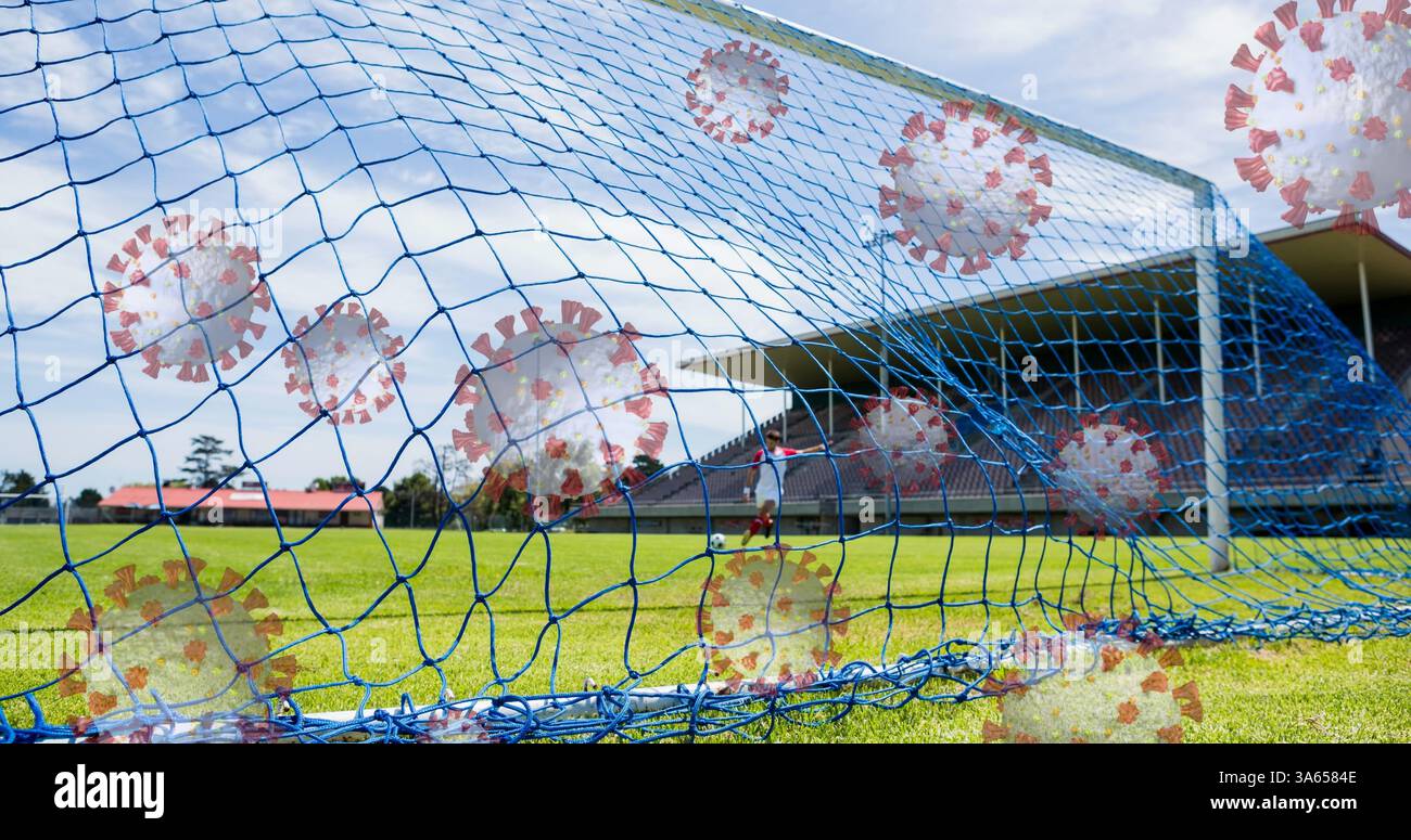 Image of 3d coronavirus cells floating over soccer player kicking ball ...