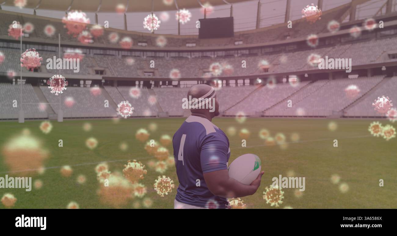 Image of 3d coronavirus cells floating over rugby player holding rugby ...