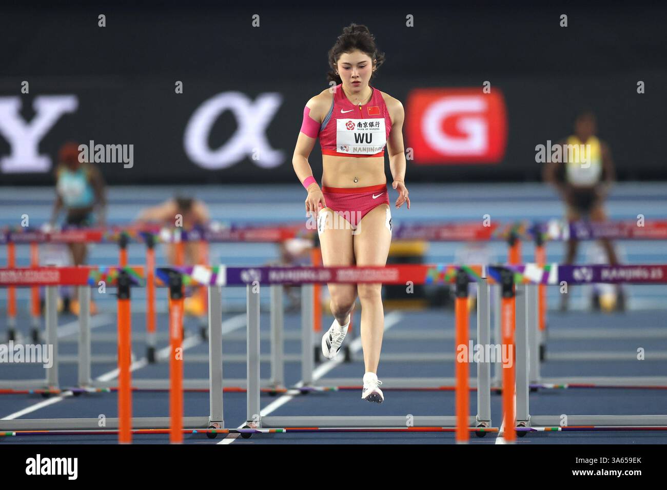 Nanjing,China.23th March 2025. Wu Yanni of China advances to the women ...
