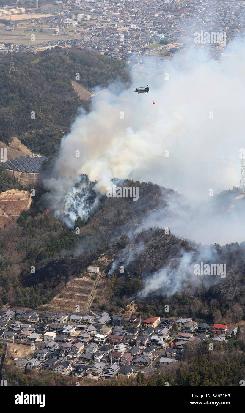 An aerial photo shows a spreading forest fire in Imabari, Ehime ...