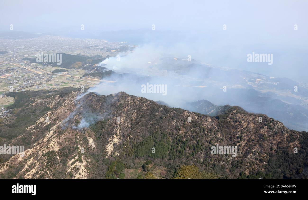 An aerial photo shows a spreading forest fire in Imabari, Ehime ...