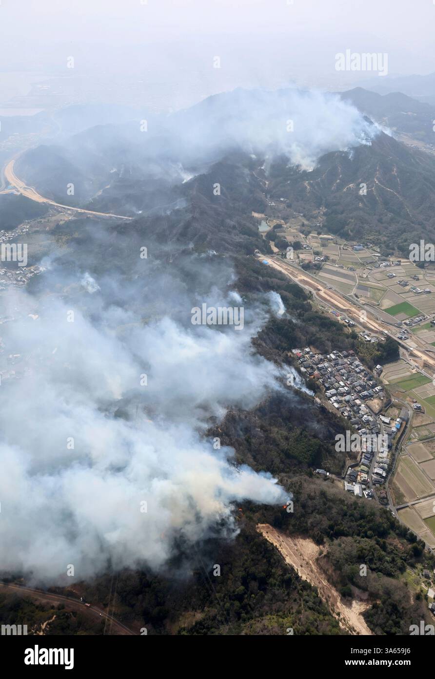 An aerial photo shows a spreading forest fire in Imabari, Ehime ...